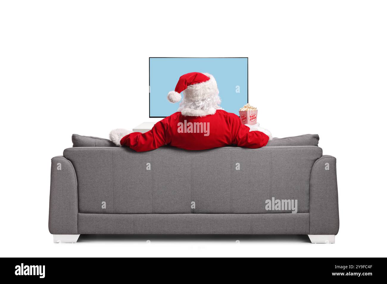 Santa claus watching tv with a box of popcorn isolated on white ...