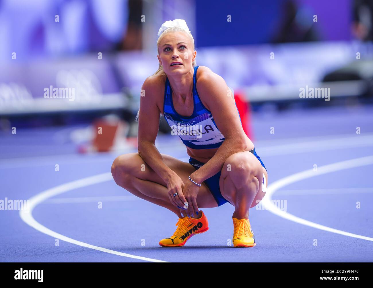 Lotta Harala participating in the 100 meters hurdles at the Paris 2024 ...