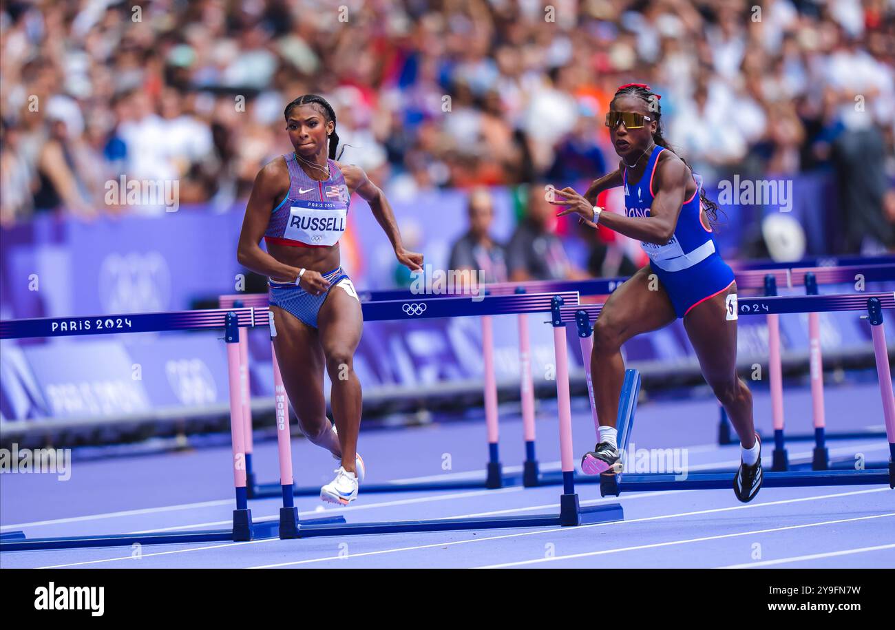Masai Russell participating in the 100 meters hurdles at the Paris 2024 ...