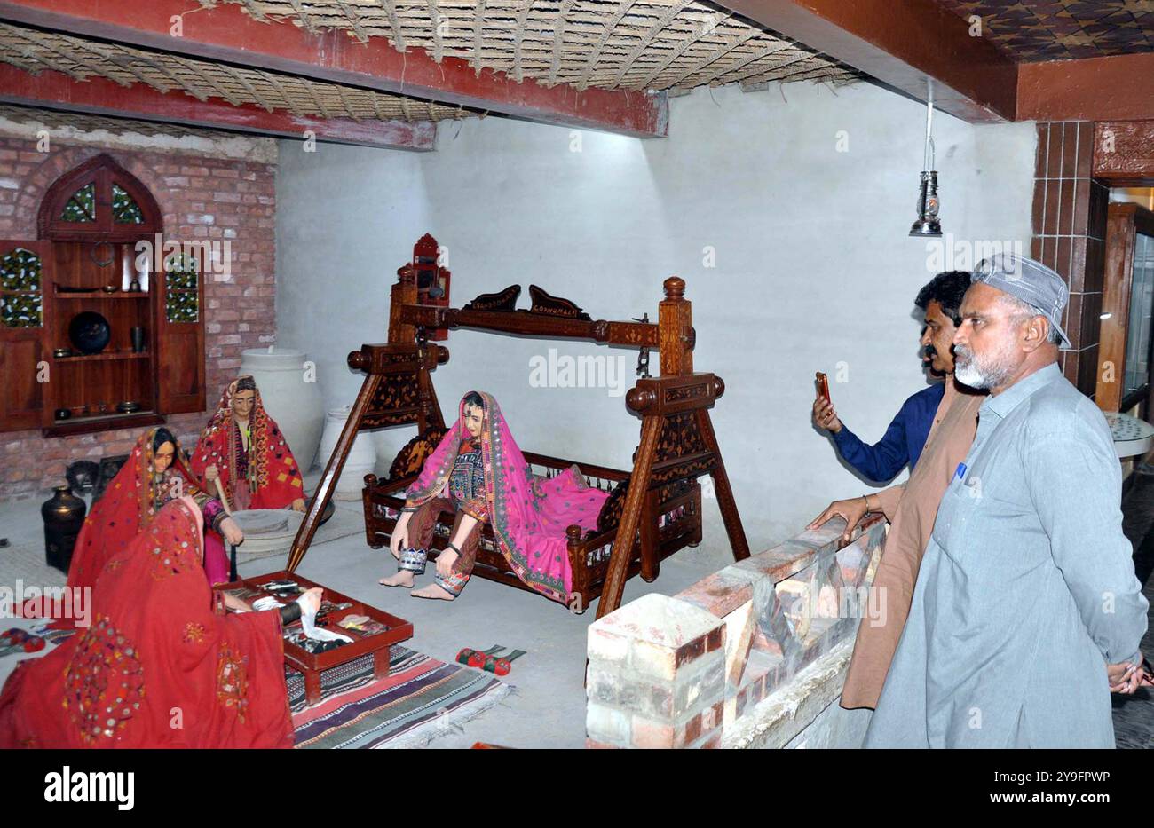 Visitors take keen interest in pictures and sculptures during Sindh ...