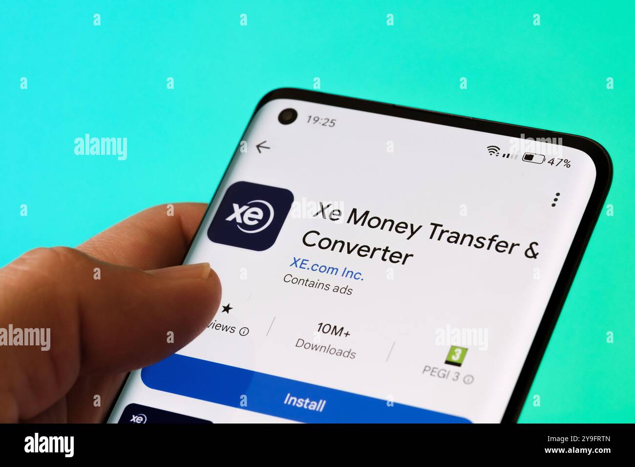 Xe Money Transfer & Converter app displayed on smartphone screen ...