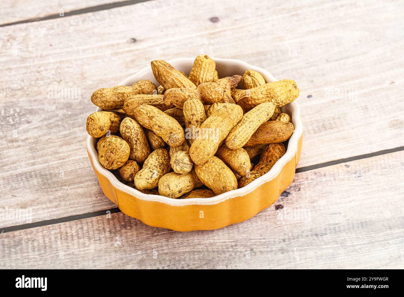Raw ripe unpeeled peanut heap snack Stock Photo - Alamy