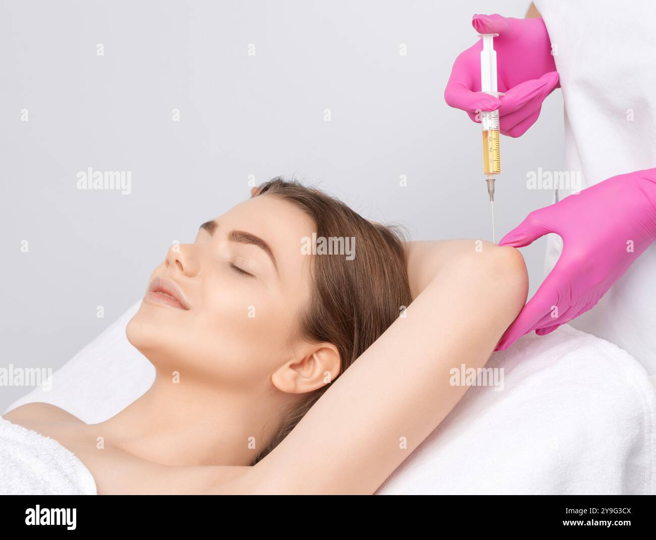 Doctor doing stem cell therapy on a patient's elbow after the injury ...