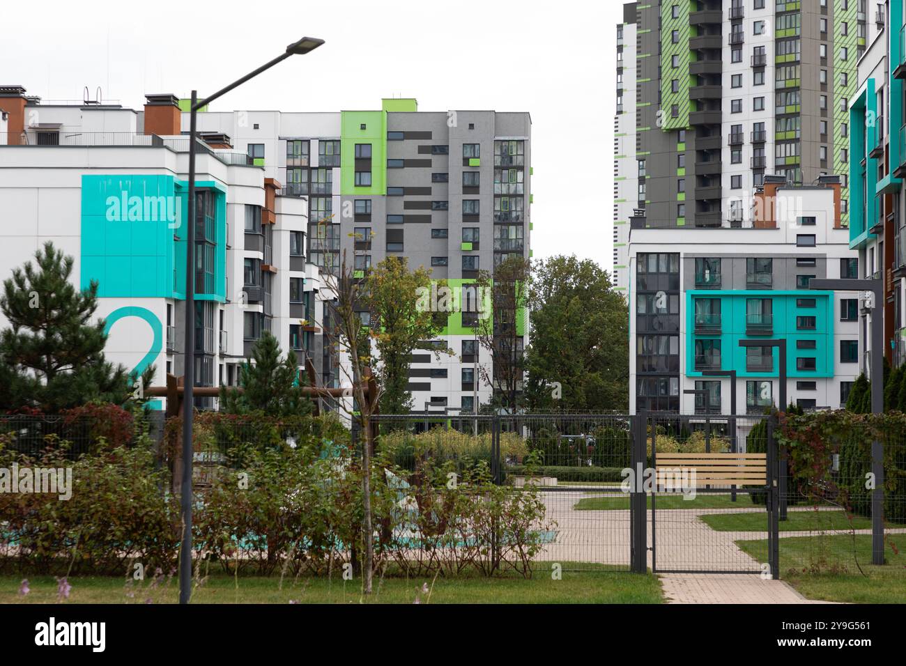 Modern high-rise apartment buildings in a residential area surrounded ...