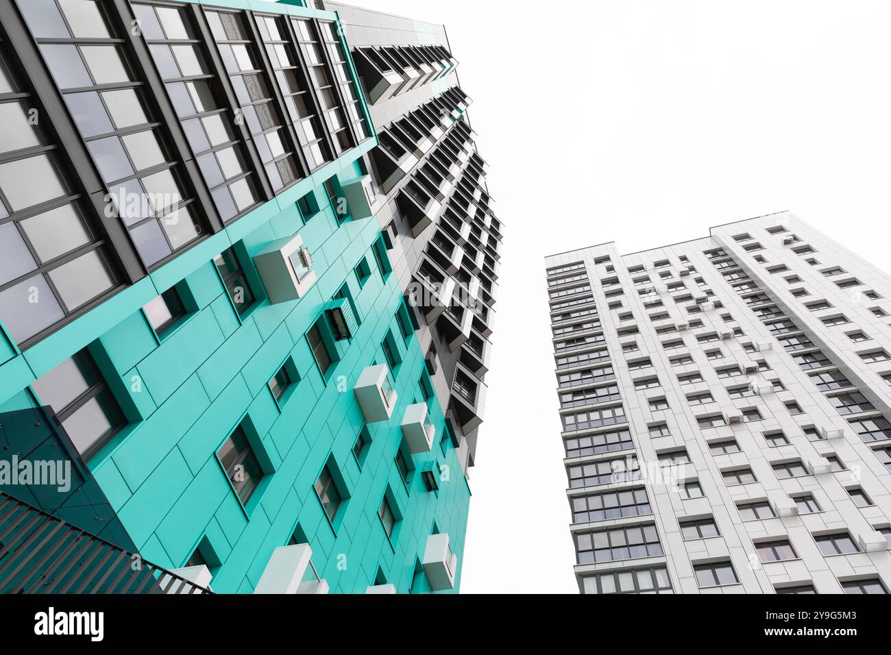 Two striking high-rise apartment buildings dominate the skyline ...