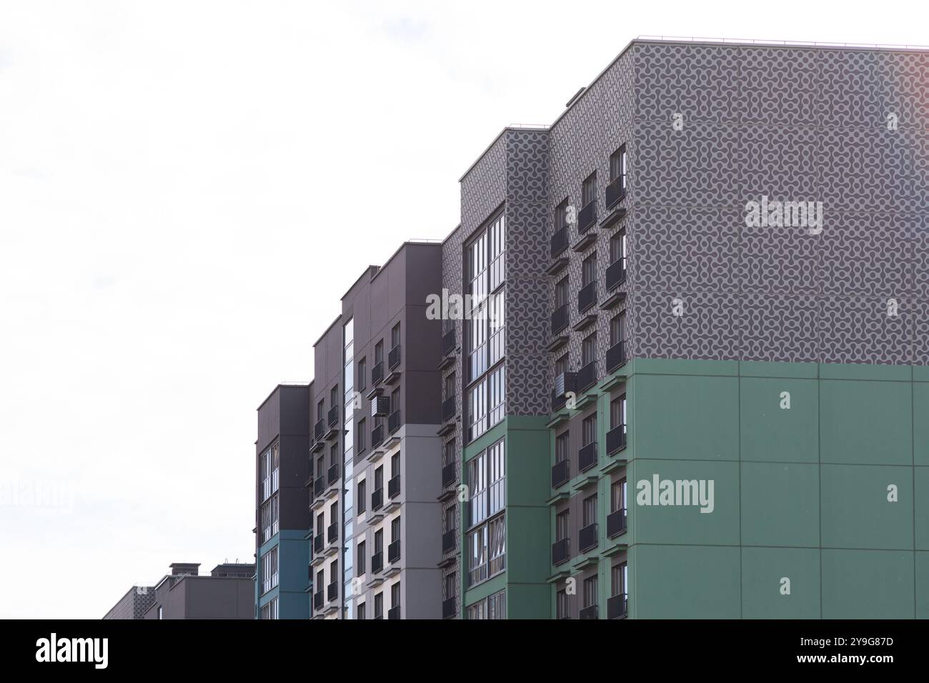 The view showcases contemporary high-rise apartment buildings in a bustling residential area ...