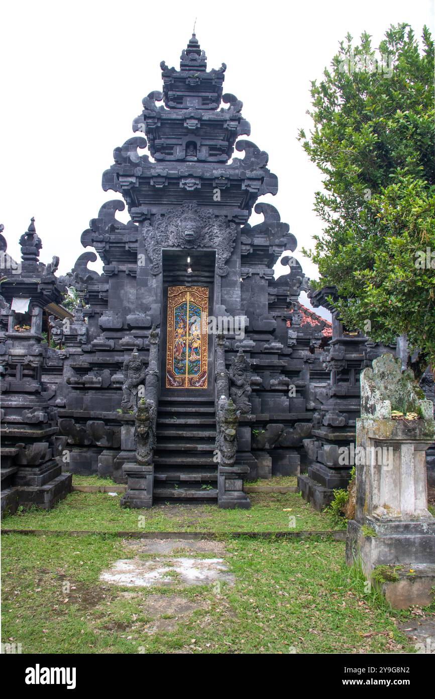 Temple complex of the Hindu faith. Temple made of lava stone in front ...