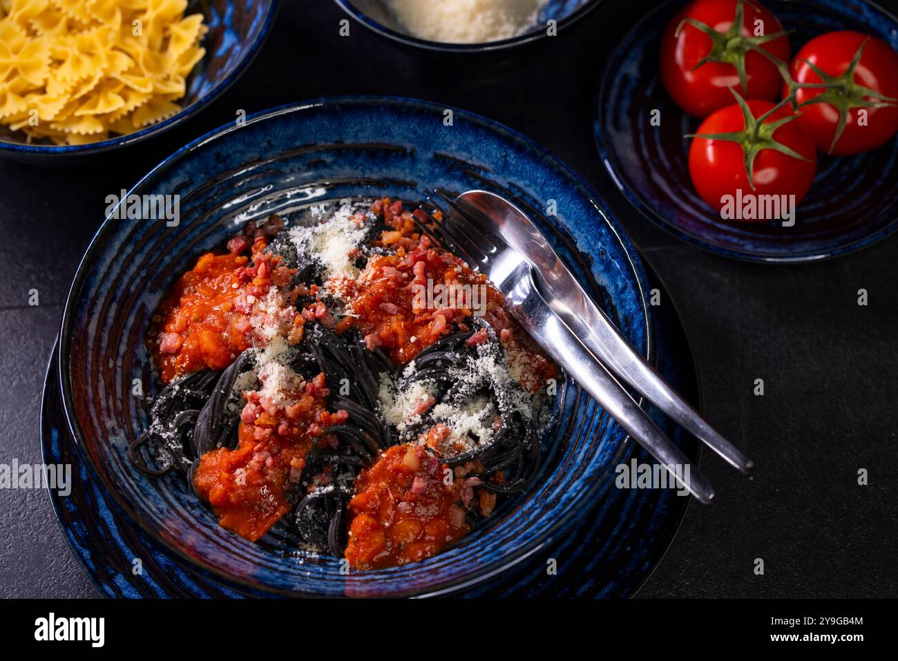 Italian still life with pasta and tomatoes Stock Photo - Alamy