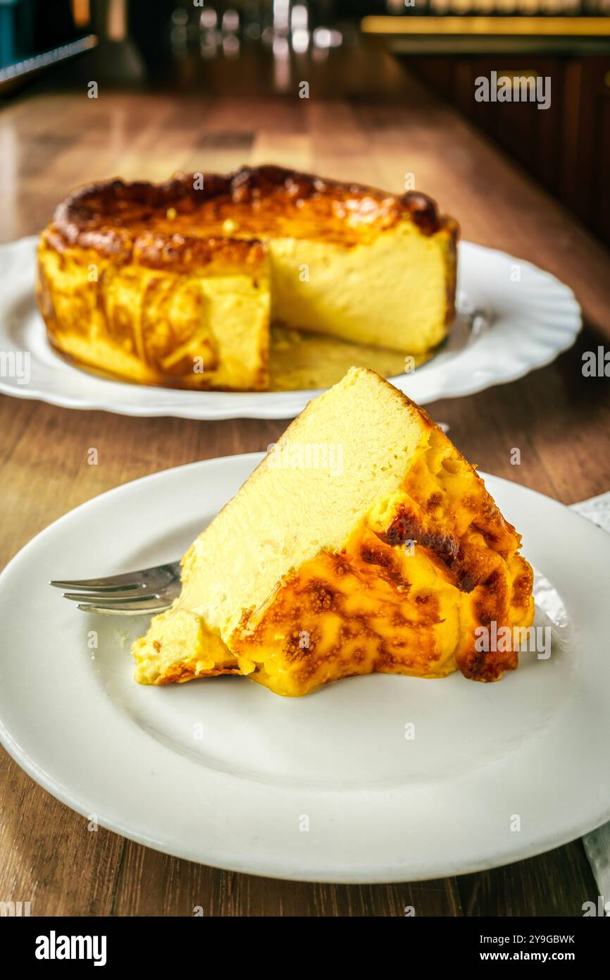 Famous San Sebastian cheesecake displayed on a traditional Basque bar ...