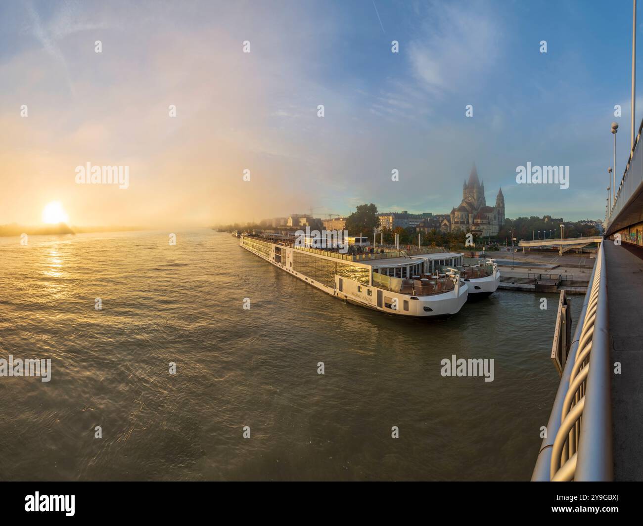 river Donau Danube, sunrise, mist, bridge Reichsbrücke, cruise ship ...