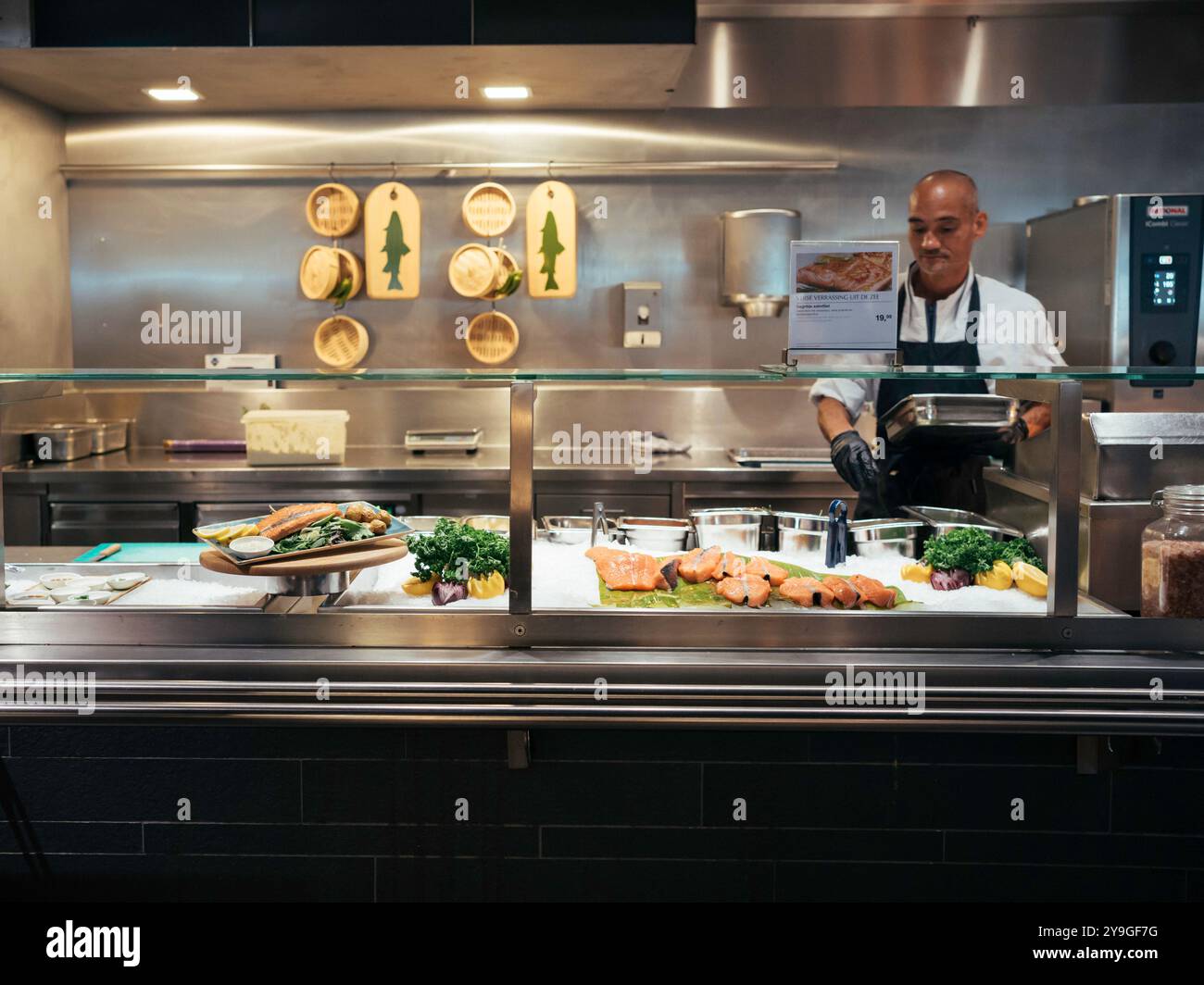 Chef behind counter of fish restaurant in Amsterdam Stock Photo - Alamy