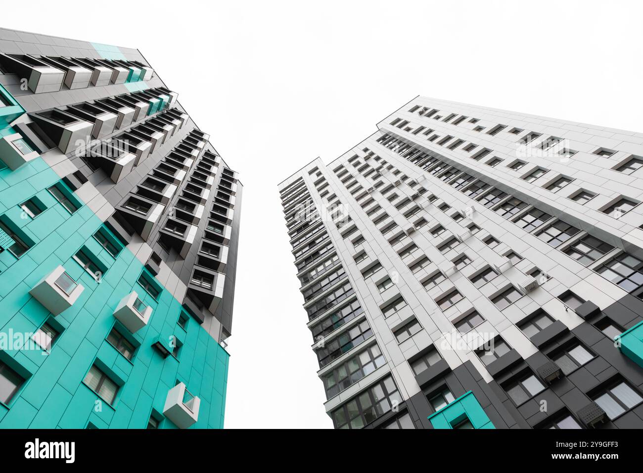 Two towering high-rise apartment buildings showcase contemporary ...