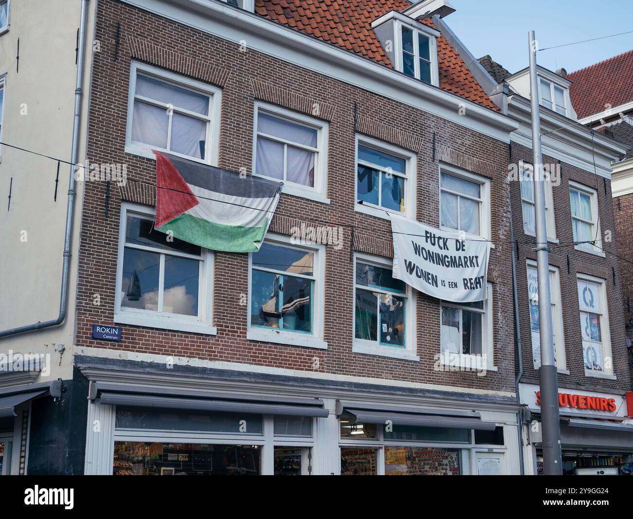 Palestine flag and protest banner against the housing market of ...
