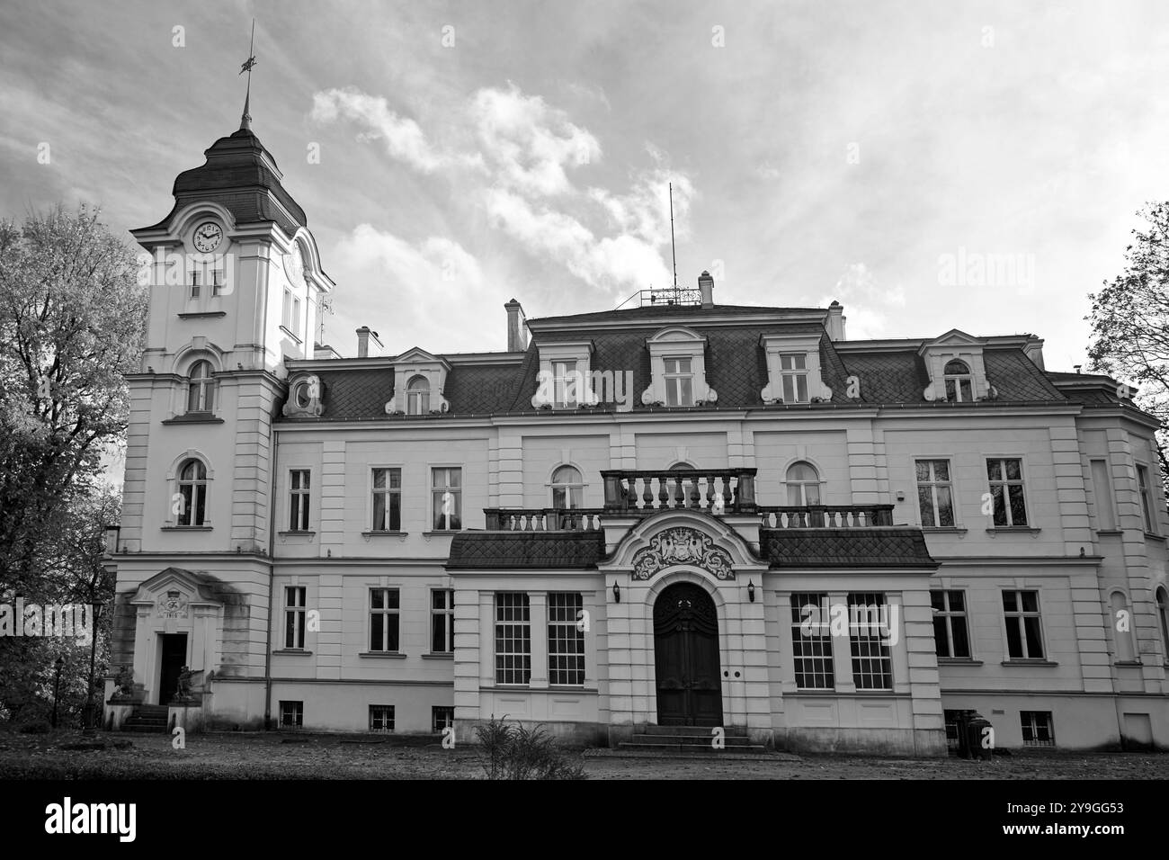 historic palace with clock tower in Obrzycko during autumn, Poland ...