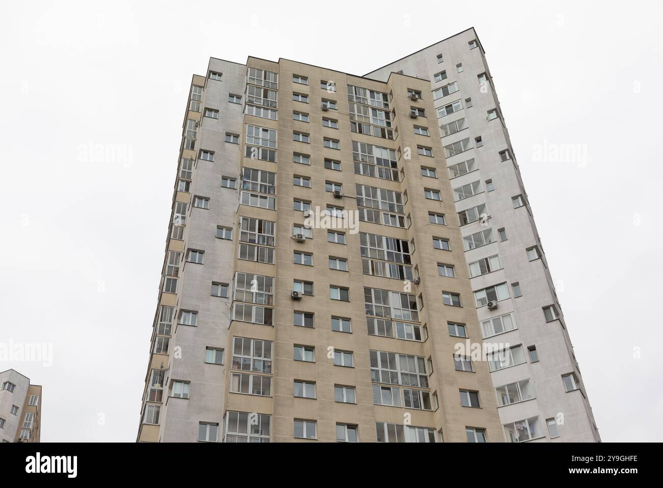 The tall, contemporary apartment buildings dominate the skyline of a ...