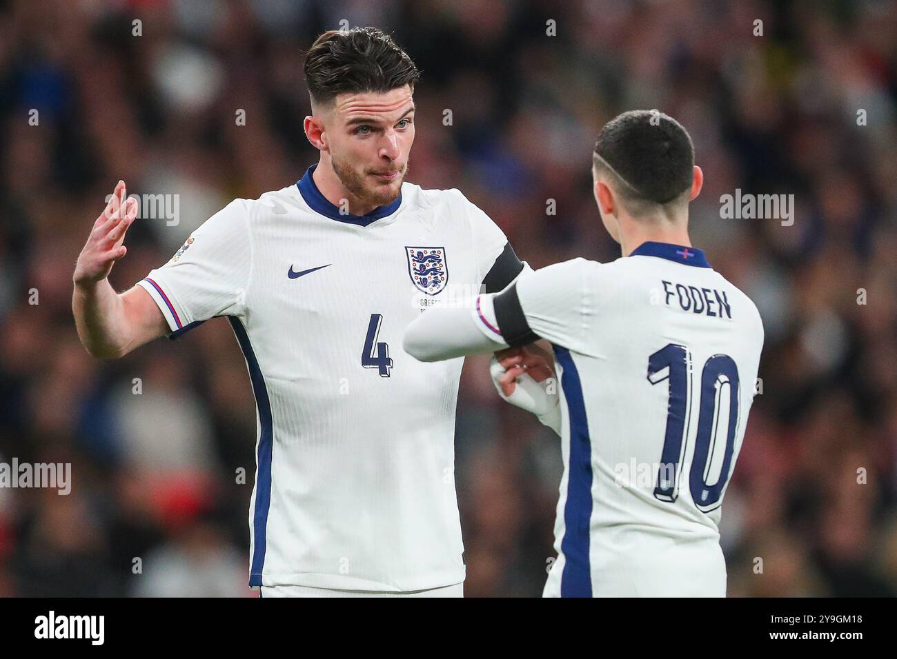 Declan Rice of England talks to Phil Foden during the UEFA Nations ...