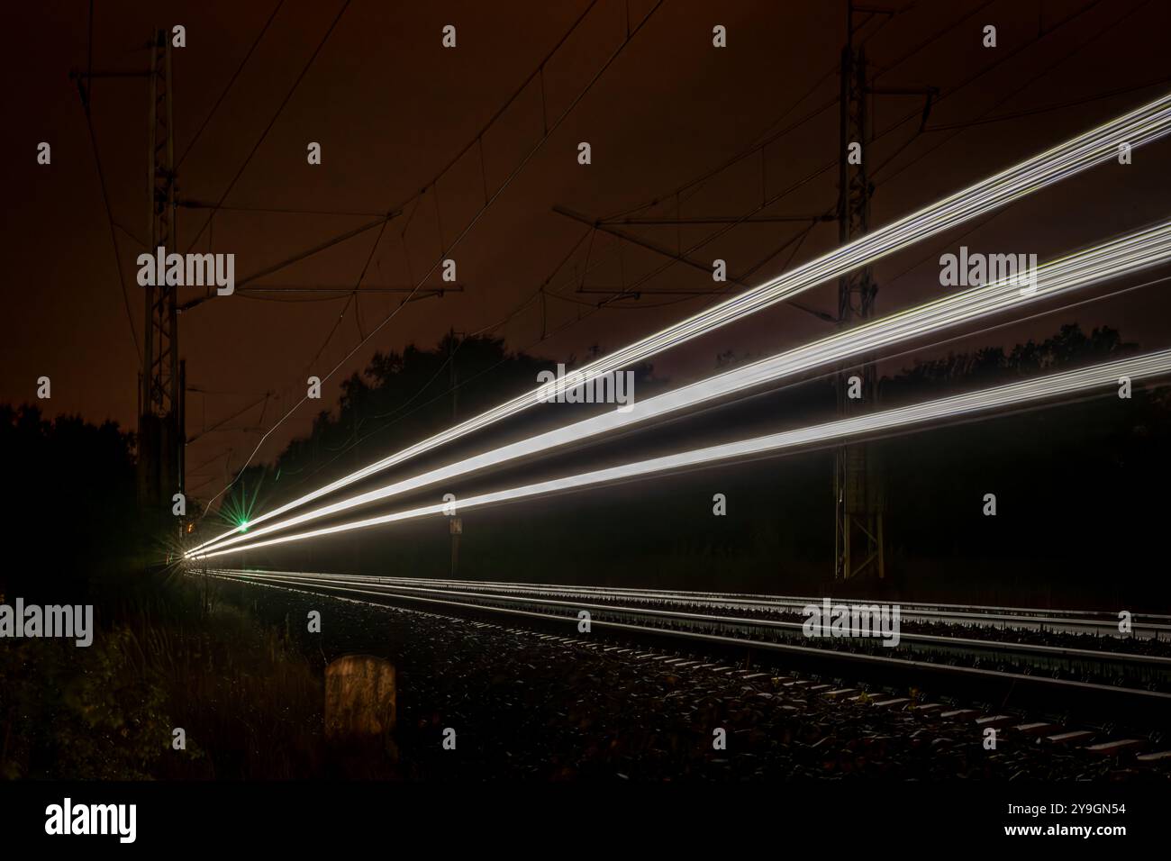 Light train railway color lines in dark night near Roudnice nad Labem ...