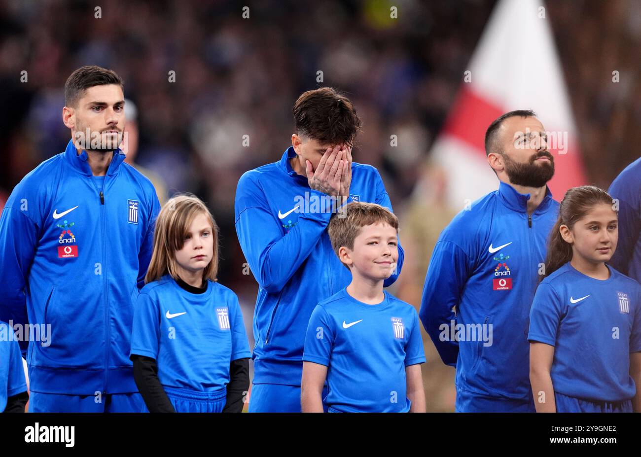 Greece's Lazaros Rota (centre) during the national anthem before the ...