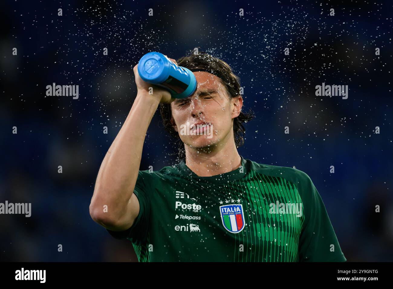 Rome, Italy. 10th Oct, 2024. Riccardo Calafiori of Italy sprays water ...