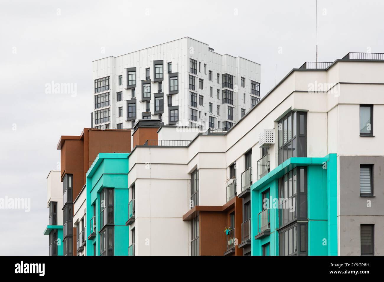 Modern high-rise apartment buildings in a residential area reflecting ...