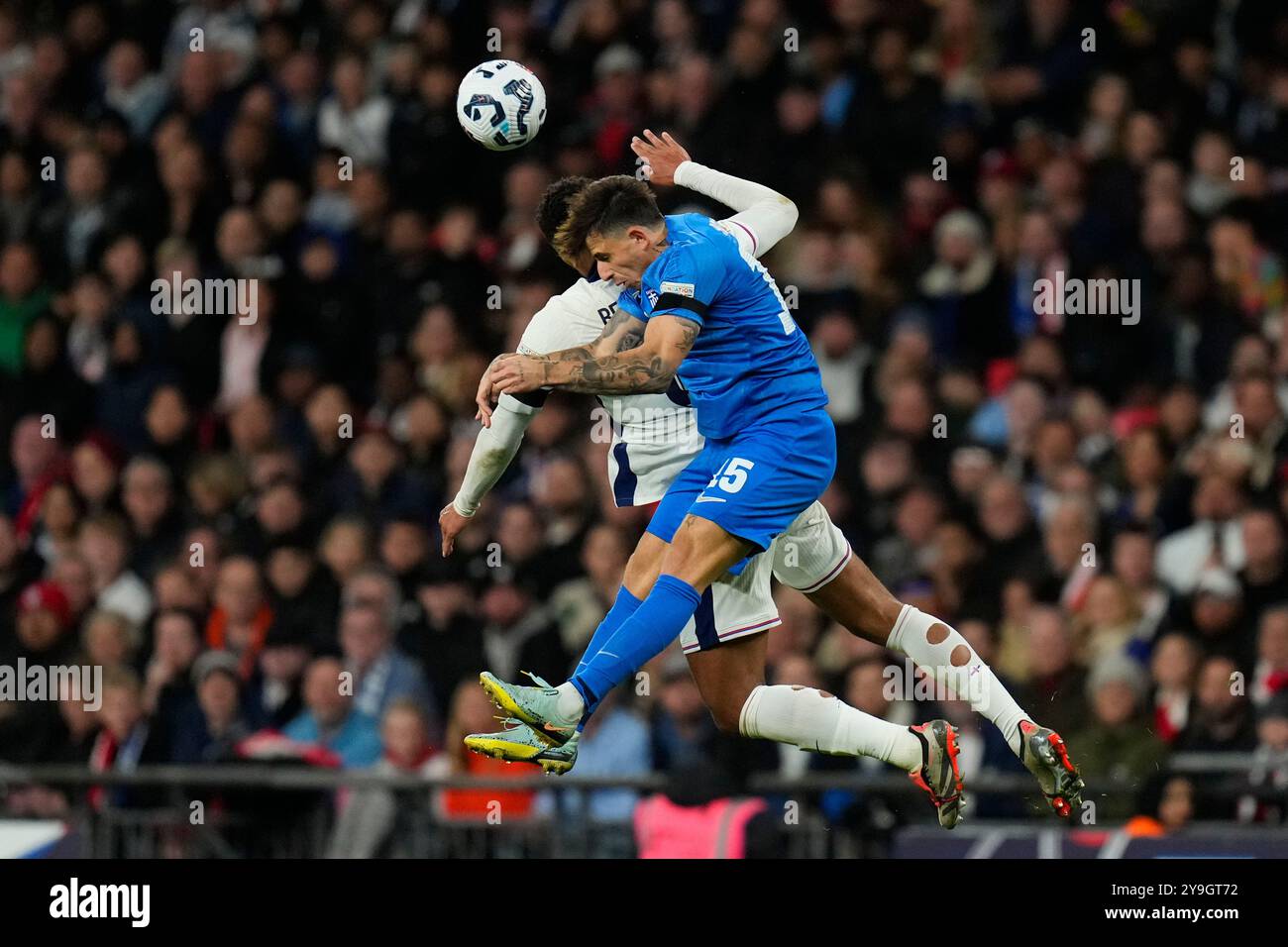 Greece's Lazaros Rota, front, and England's Jude Bellingham challenge ...