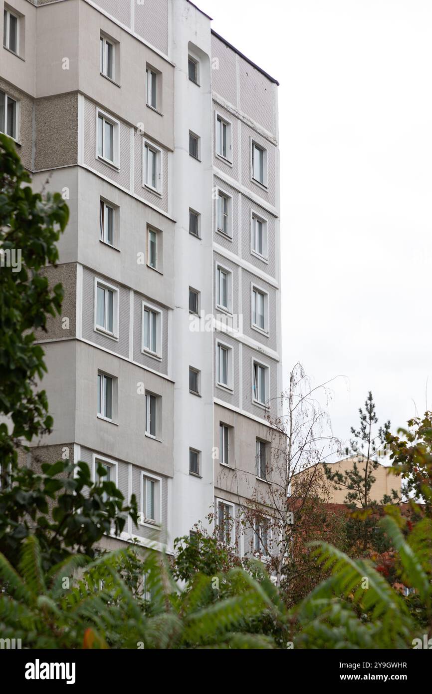 Residential high-rise buildings in a suburban area with greenery and ...