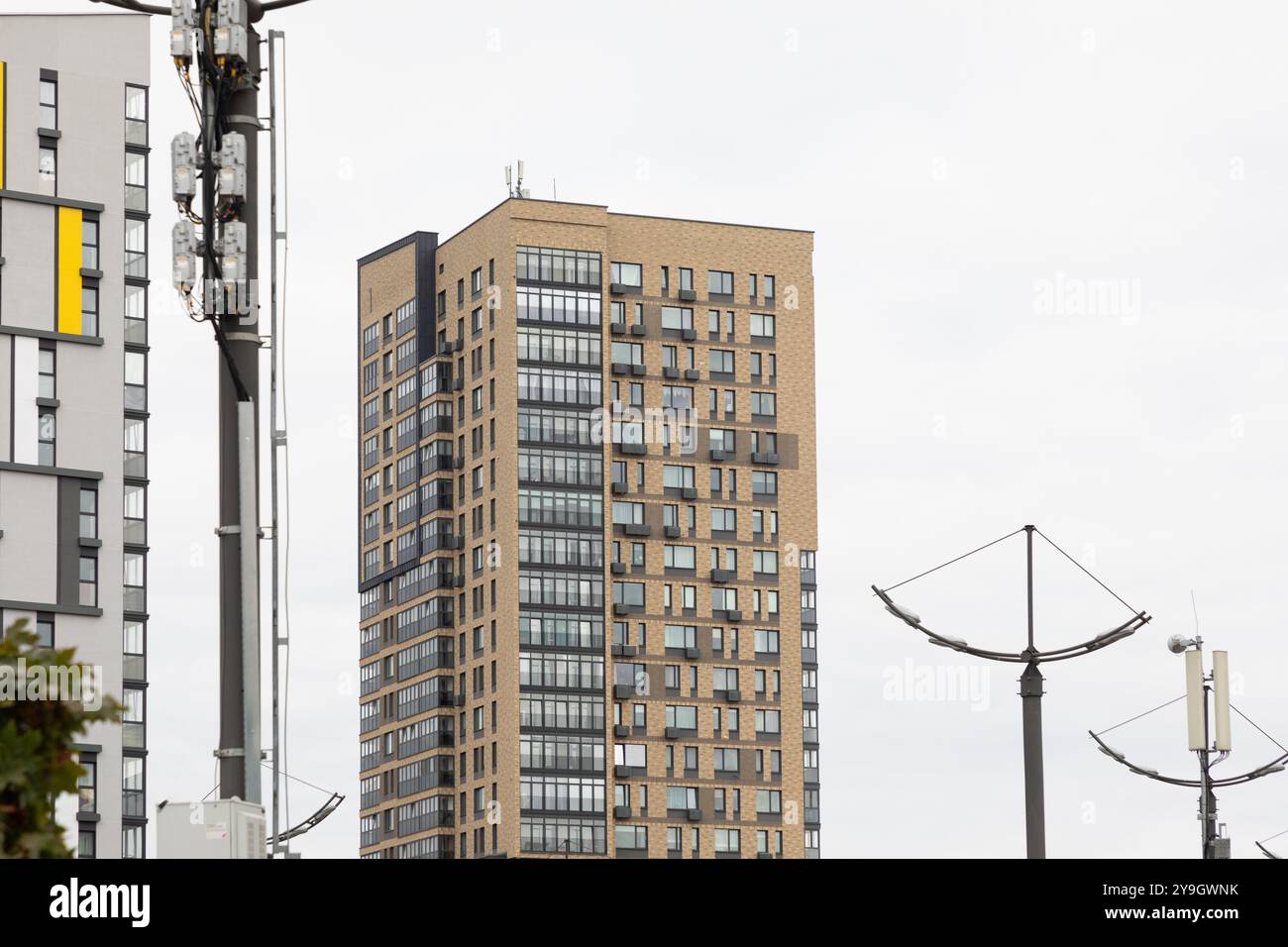 High-rise apartment buildings in a residential area under a cloudy sky ...