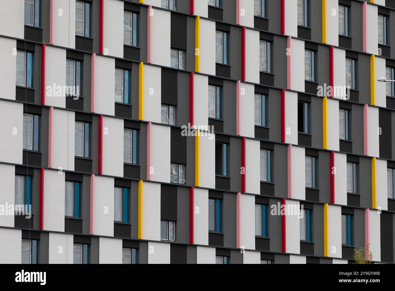 Colorful high-rise residential building in an urban area featuring ...