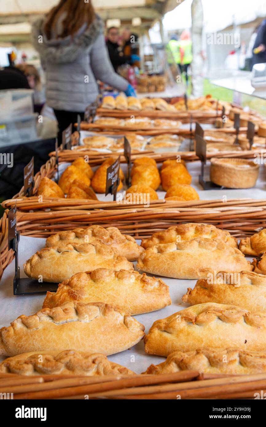 Baskets of Cornish pasties and other baked food on sale in a makers ...