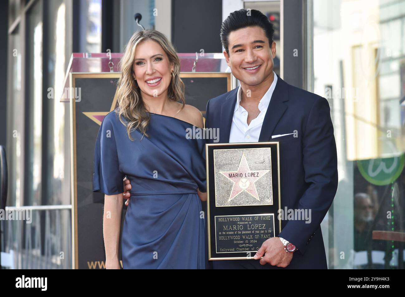 Sarah Zurell, left, and Mario Lopez attend a ceremony honoring Lopez ...