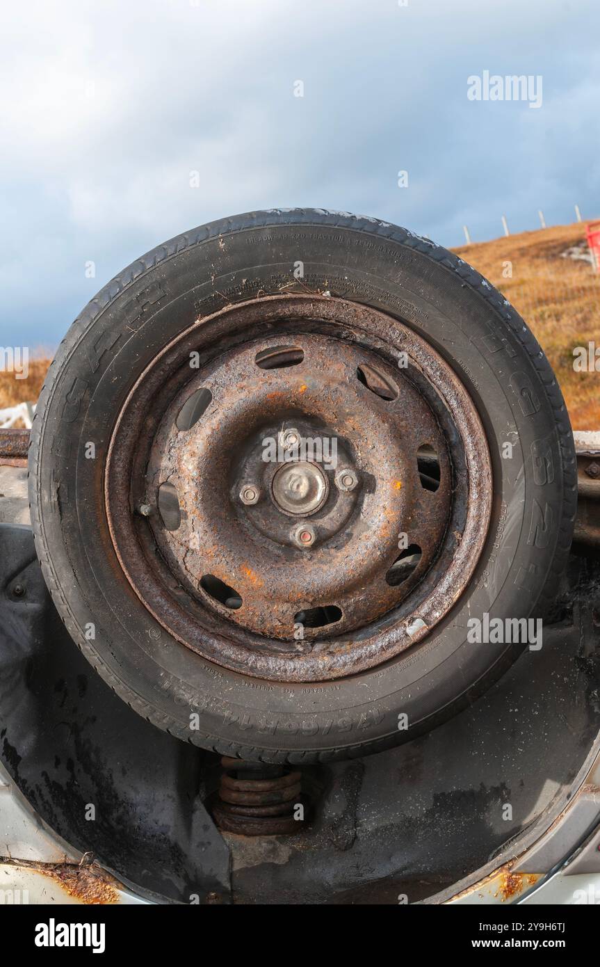 Old rusty car wheel rim and worn tire Stock Photo - Alamy