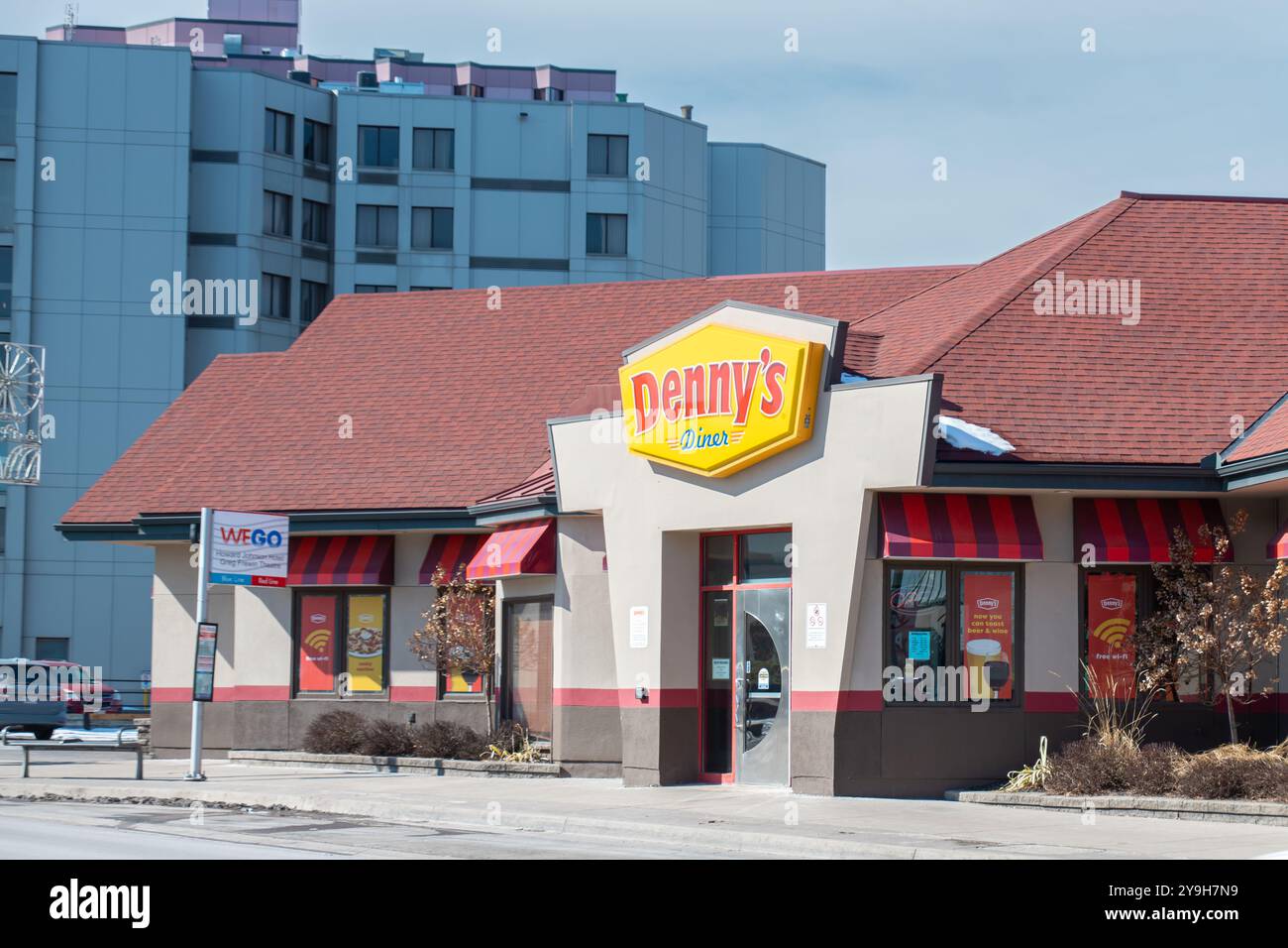 Street view of a Denny's diner featuring its iconic signage and ...