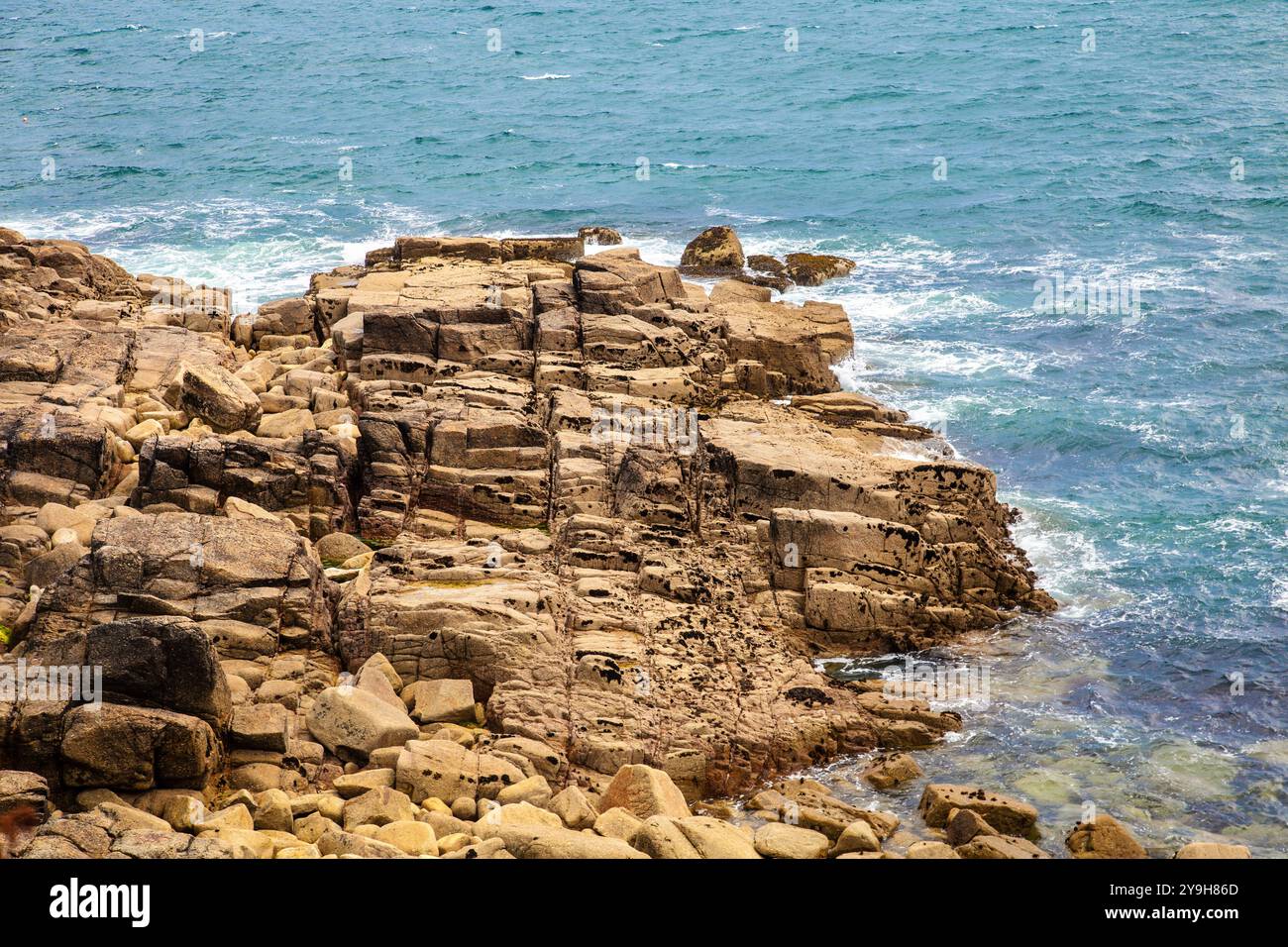 Coastal rock formations along the South West Coast Path between Kemyel ...