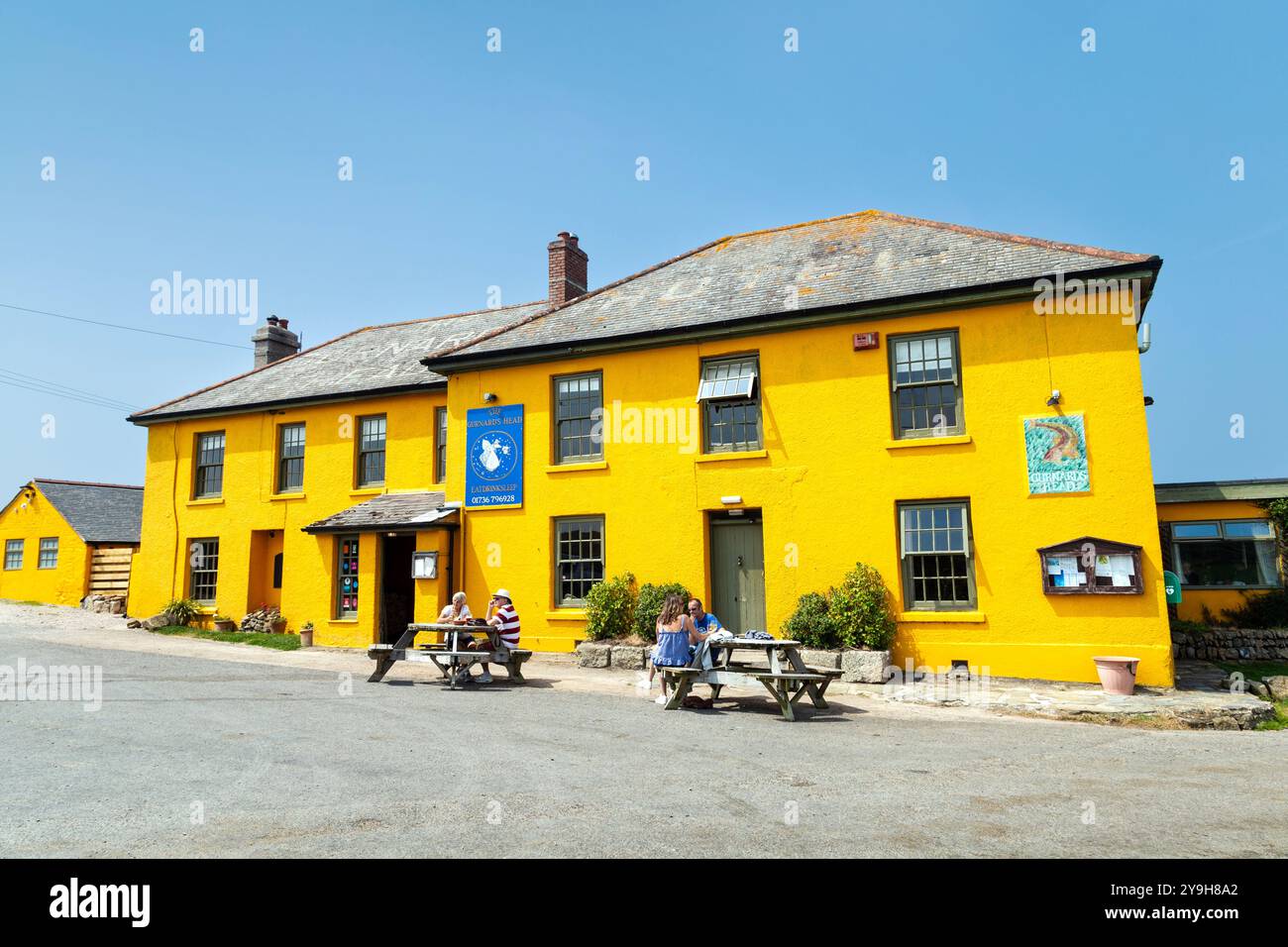 Yellow exterior of Gurnards Head pub and inn, Zennor, Cornwall, UK ...