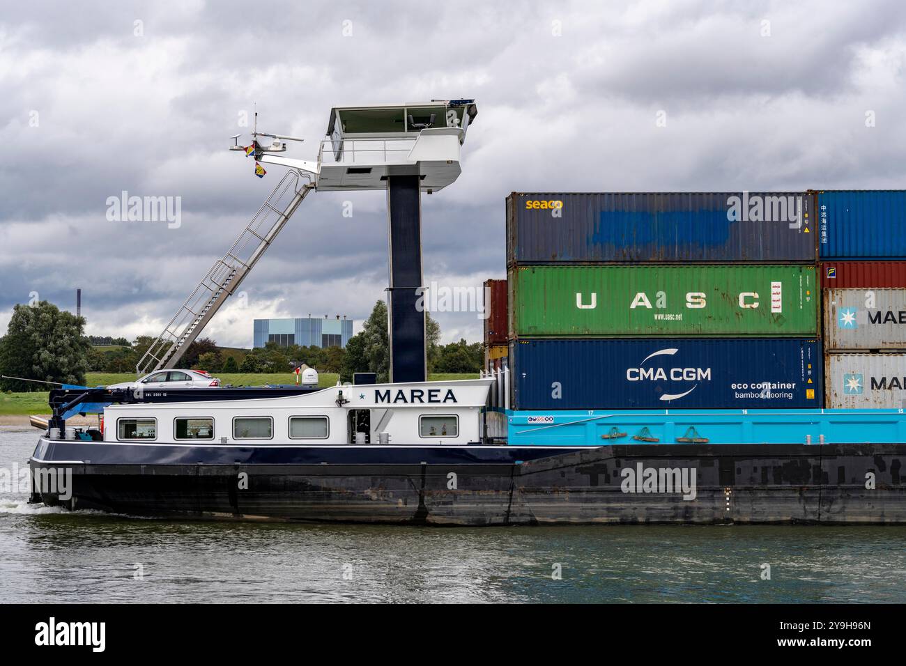 Cargo ship, loaded with containers, on the Rhine near Duisburg, the ...