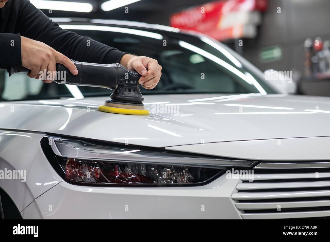 Process of polishing white car hood surface using orbital polishing ...