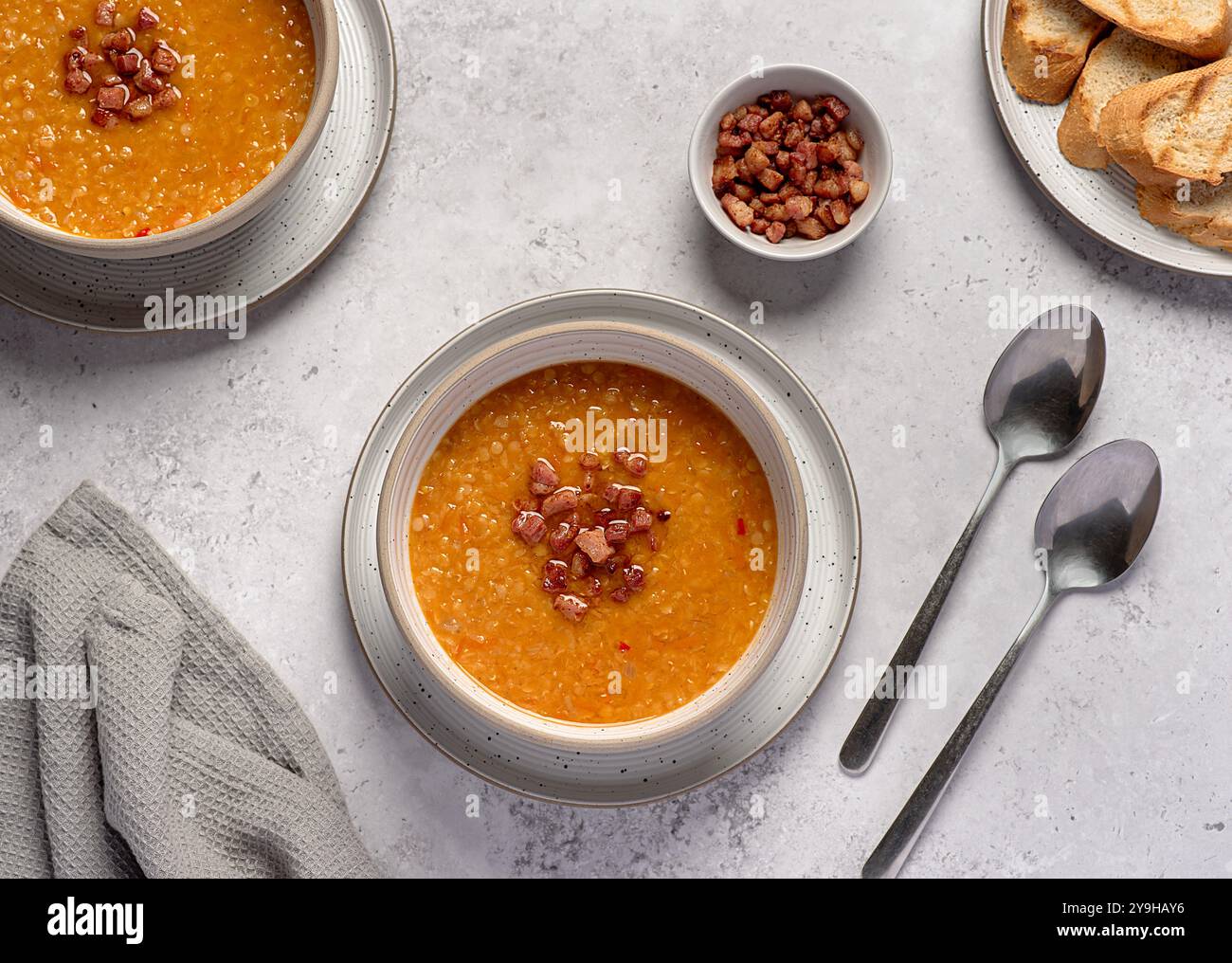 Food photography of red lentil soup with chili and bacon, carrot, onion ...