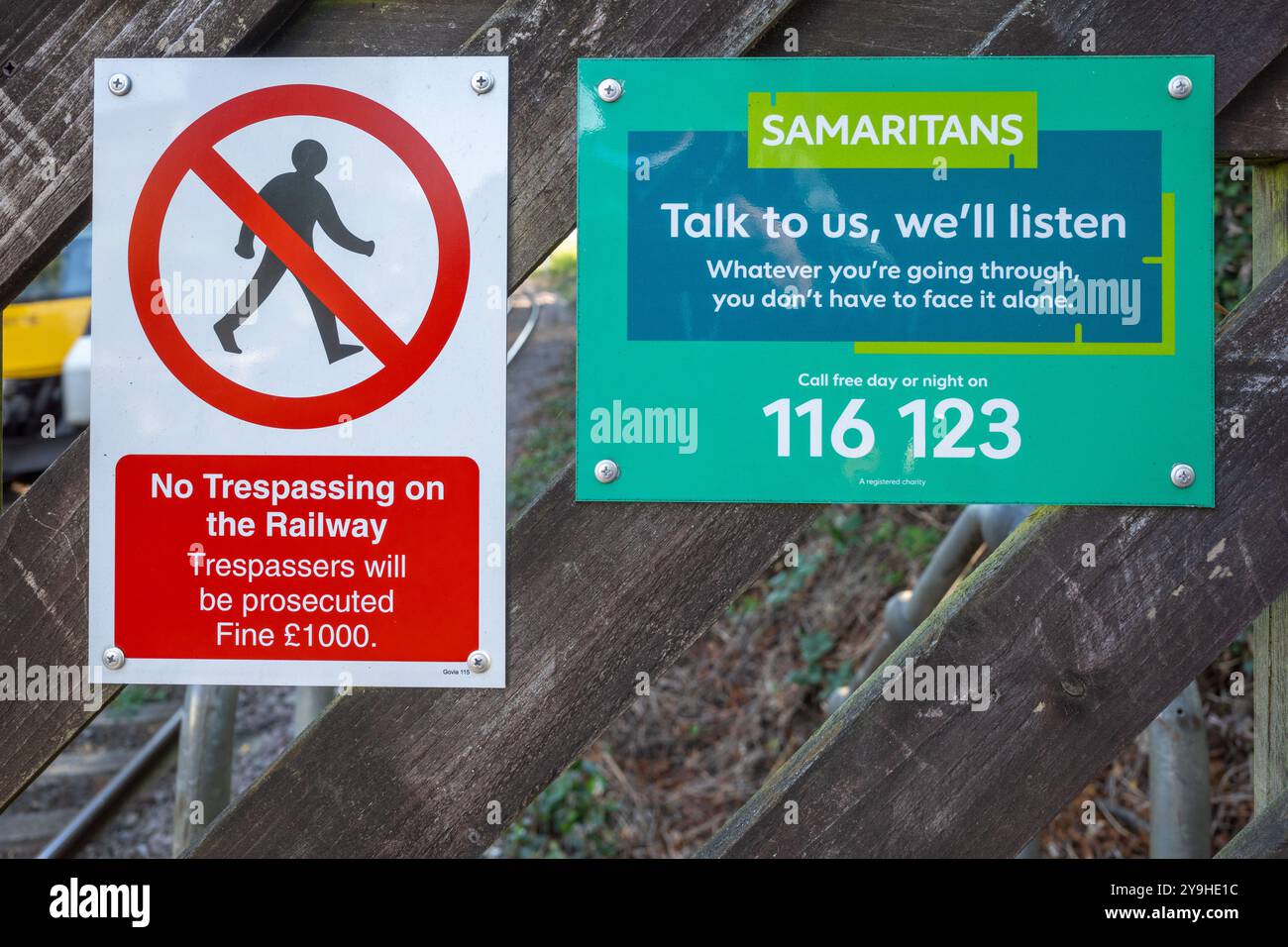 Samaritans contact detail sign and No Trespassing signs on a railway ...
