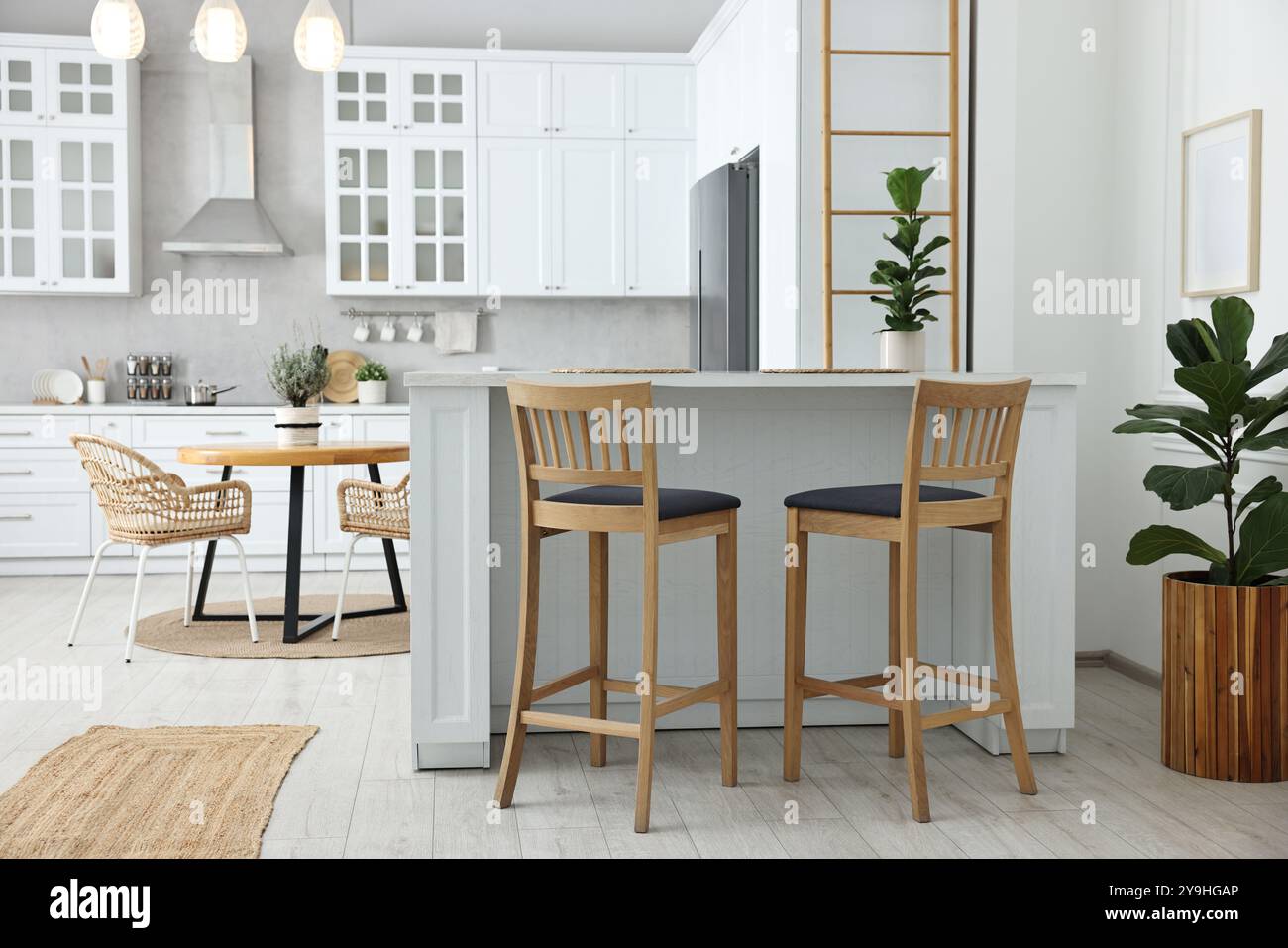 Stylish kitchen with bar stools. Interior design Stock Photo - Alamy