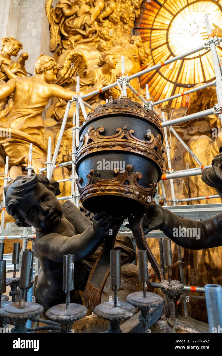 A detail of the Altar of the Chair of St. Peter surrounded by ...