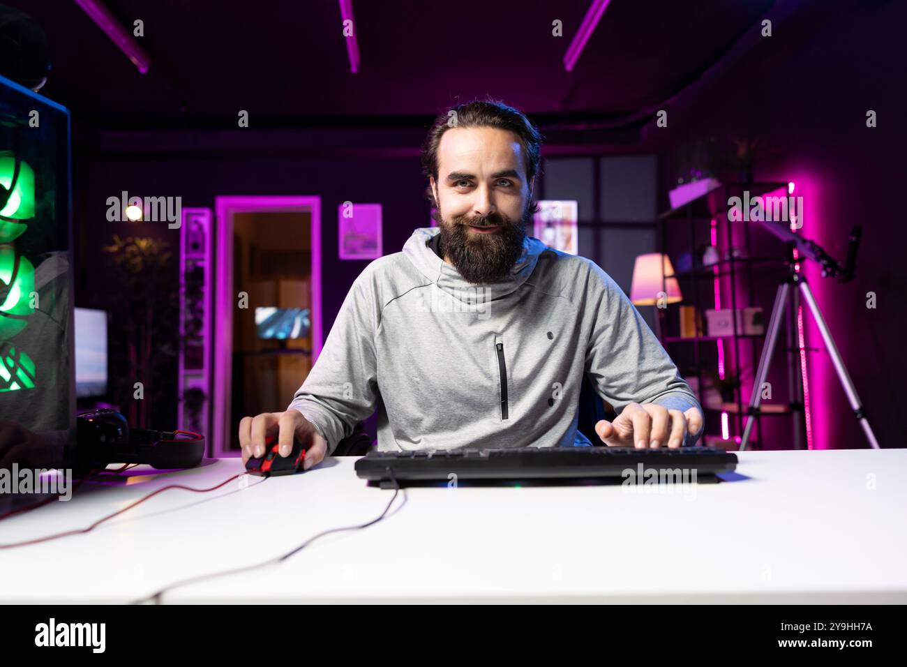 Surprised gamer playing videogame neon hi-res stock photography and ...