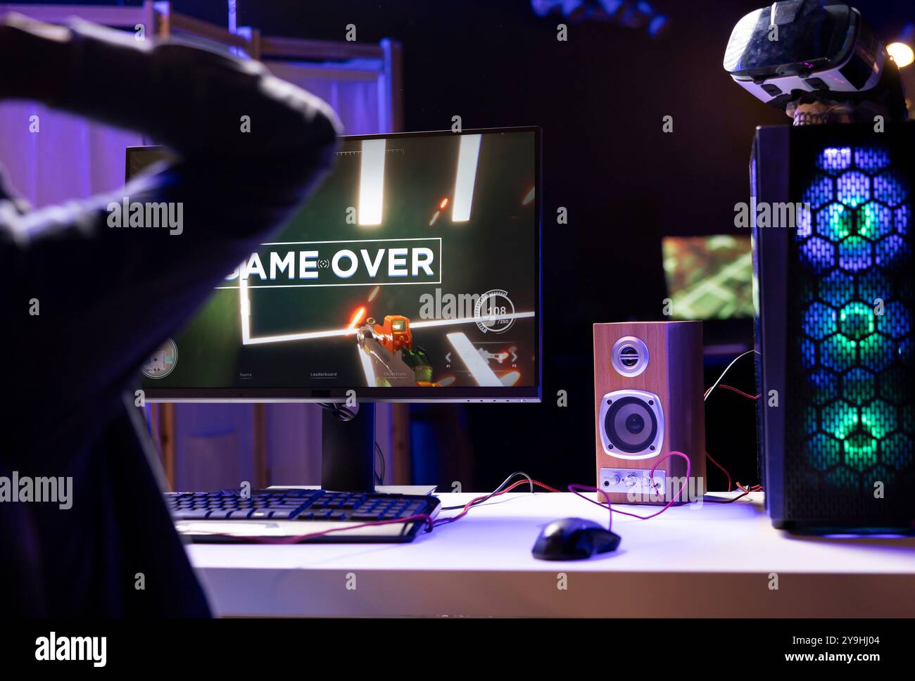 Man face palming in front of computer desktop display while playing ...