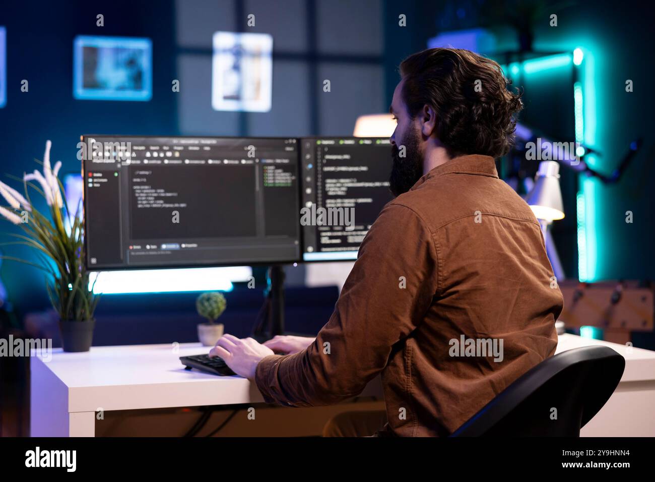 Cybersecurity expert using computer to look for company security ...