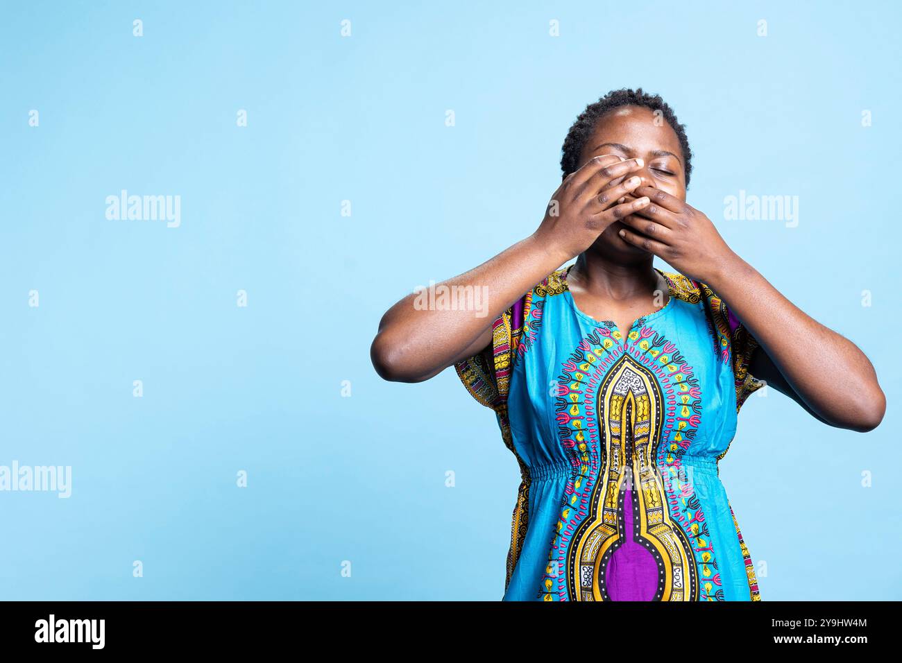 African american woman feeling fatigued in front of camera, yawning and ...