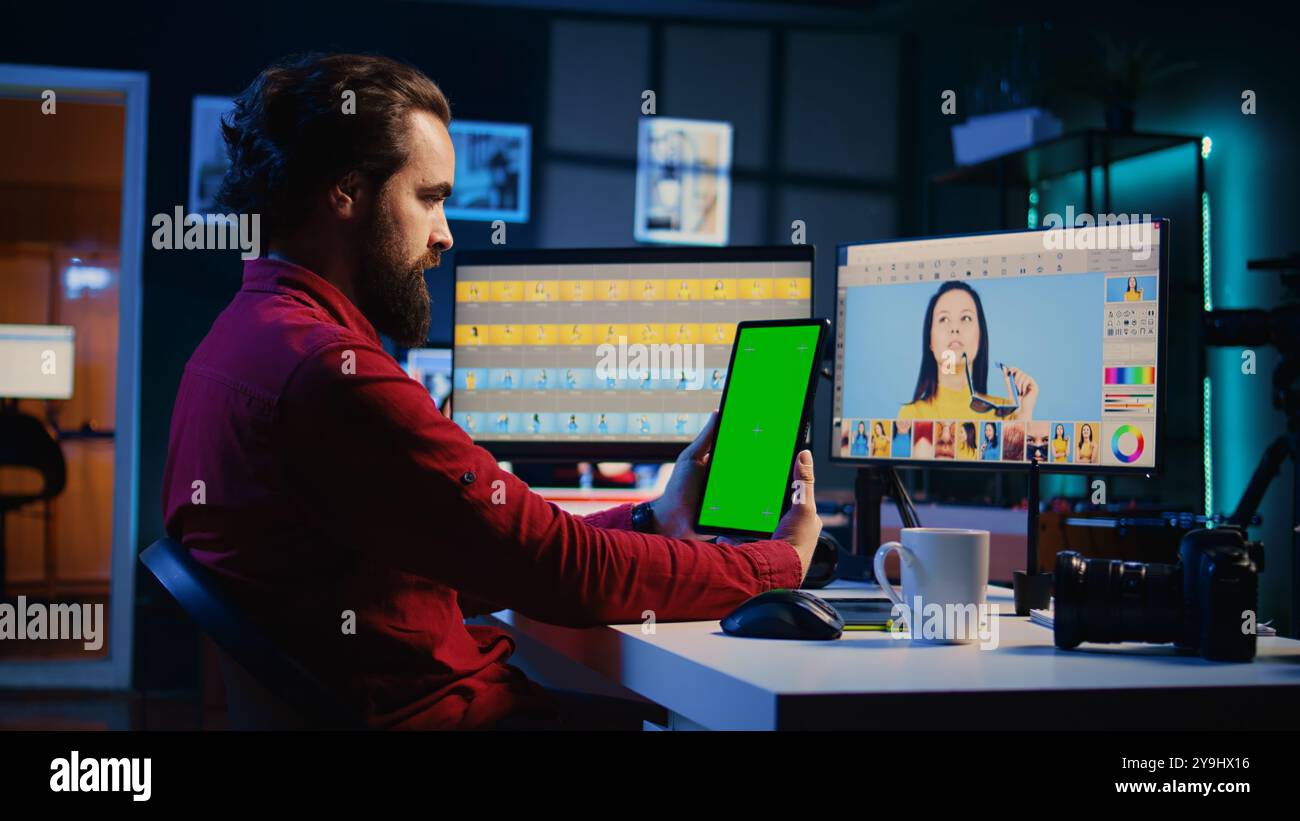 Photographer watching tutorial on mockup tablet to learn how to ...