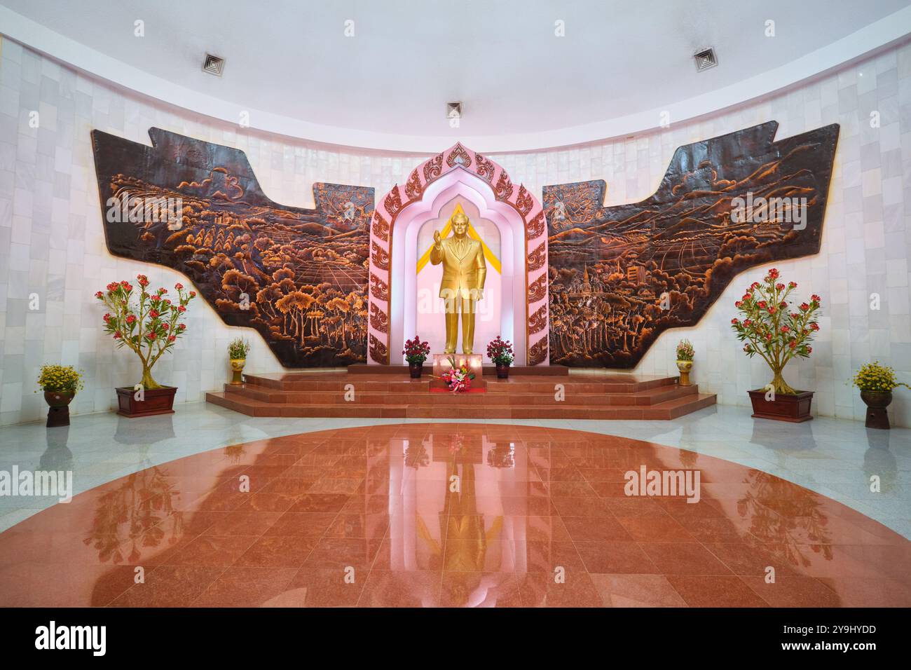 A gallery featuring a life size, gold statue of the first communist ...