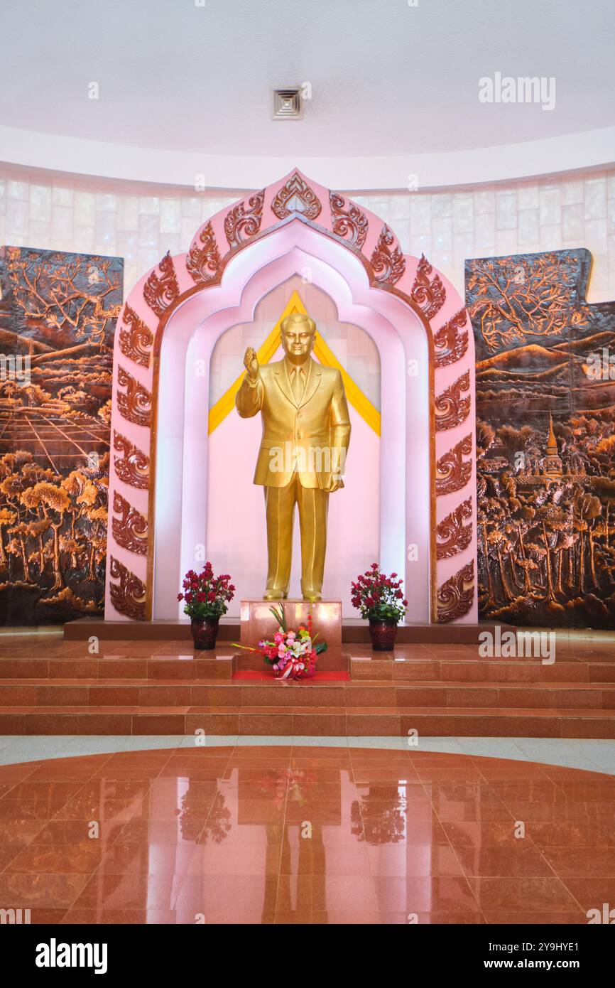 A gallery featuring a life size, gold statue of the first communist ...