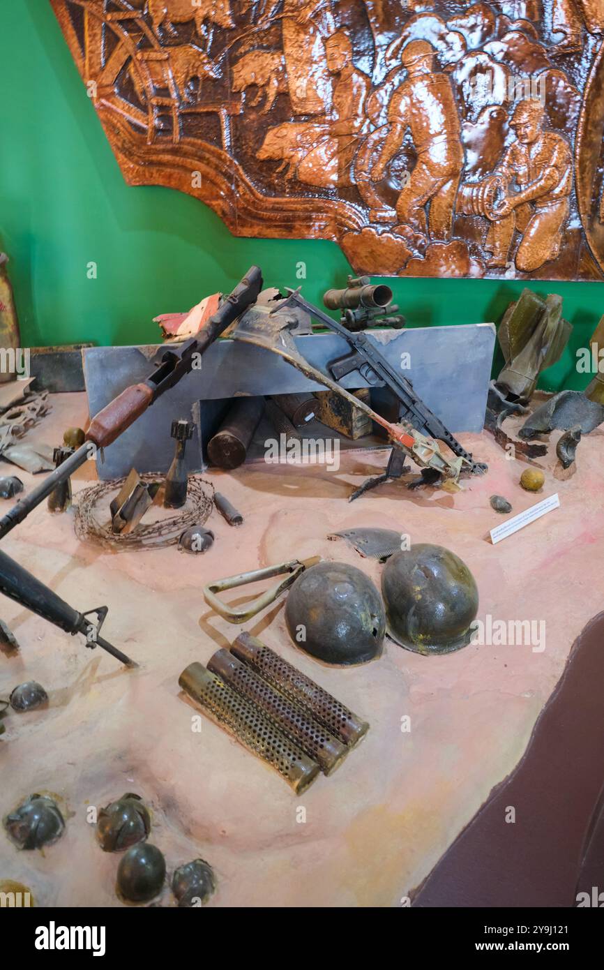 A display of guns, rifles, weapons, communication gear used during the ...