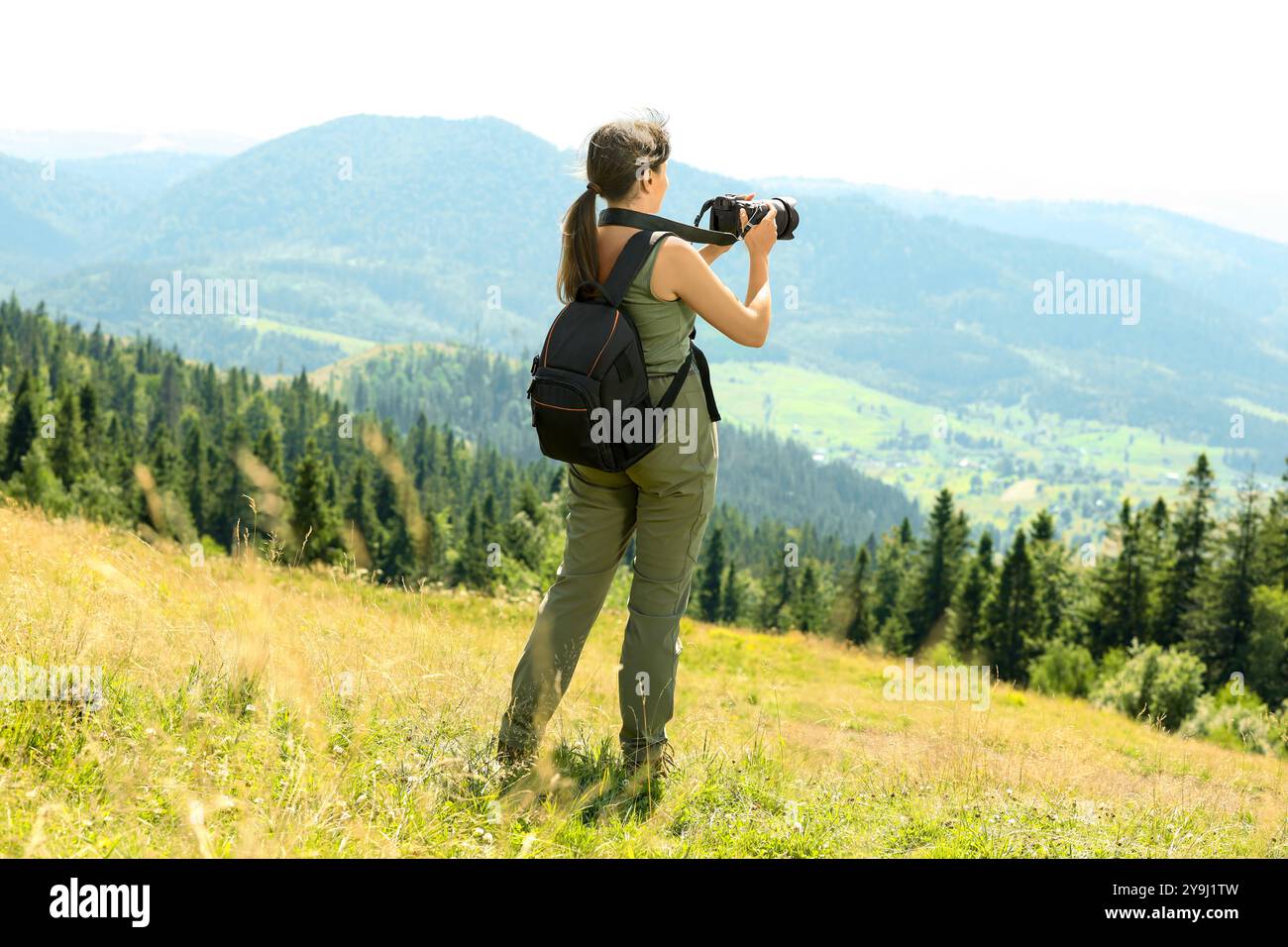 Photographer with backpack and camera taking picture of beautiful ...