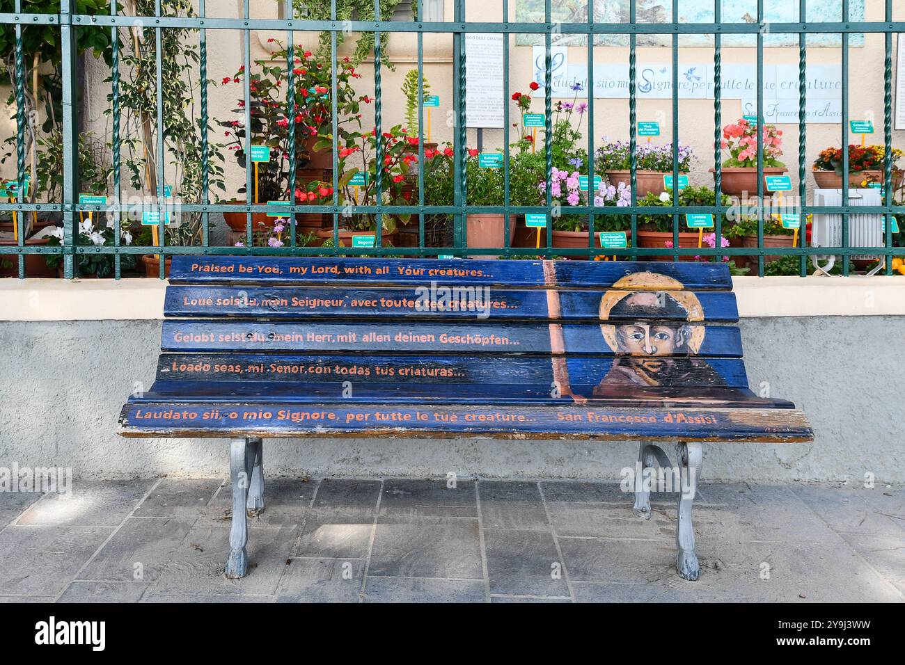 Painted bench dedicated to St Francis of Assisi in front of the ...
